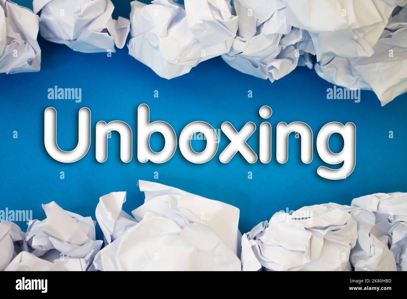 Unboxing text with Torn, Crumpled White Paper on colored background ...