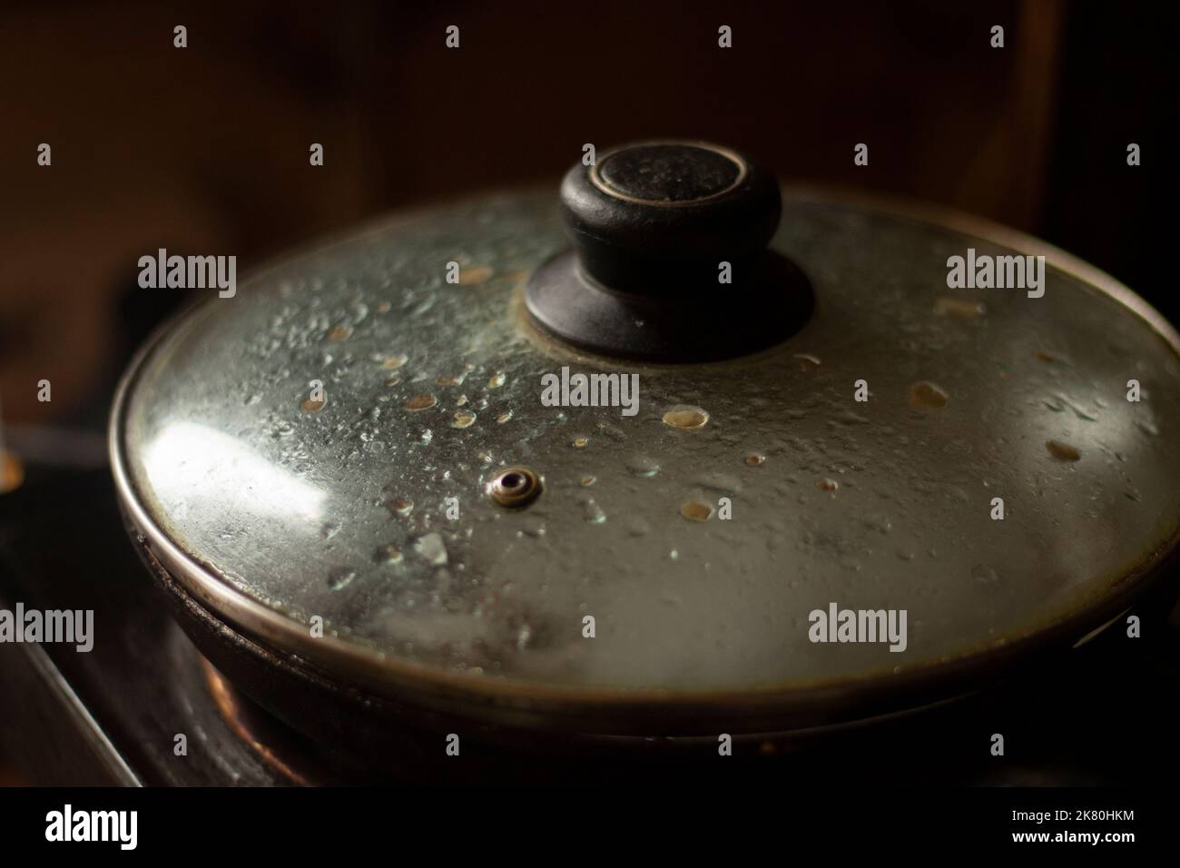 Frying pan with lid in kitchen. Frying pan with swollen glass. Interior ...
