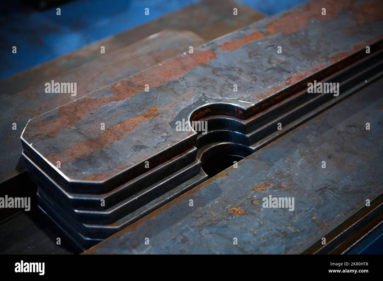 Stacks of different shape workpieces for detail making Stock Photo - Alamy