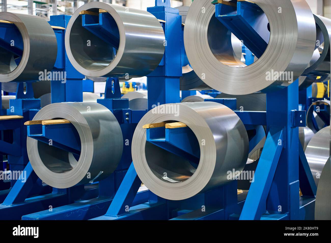 Large rolls of electrical transformer steel hang on rack Stock Photo ...