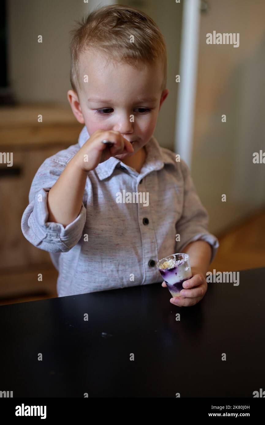 Small boy mouth open eating hi-res stock photography and images - Alamy