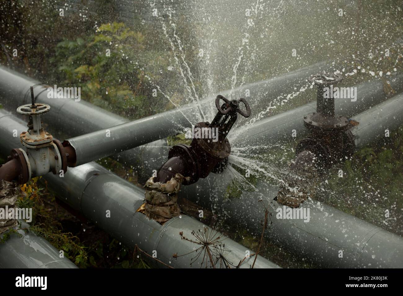 Pipeline accident. Boiling water pours from pipe. Boiler room emergency ...