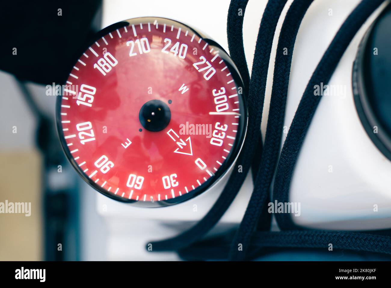 Yacht equipment compass and rope. Front view Stock Photo - Alamy