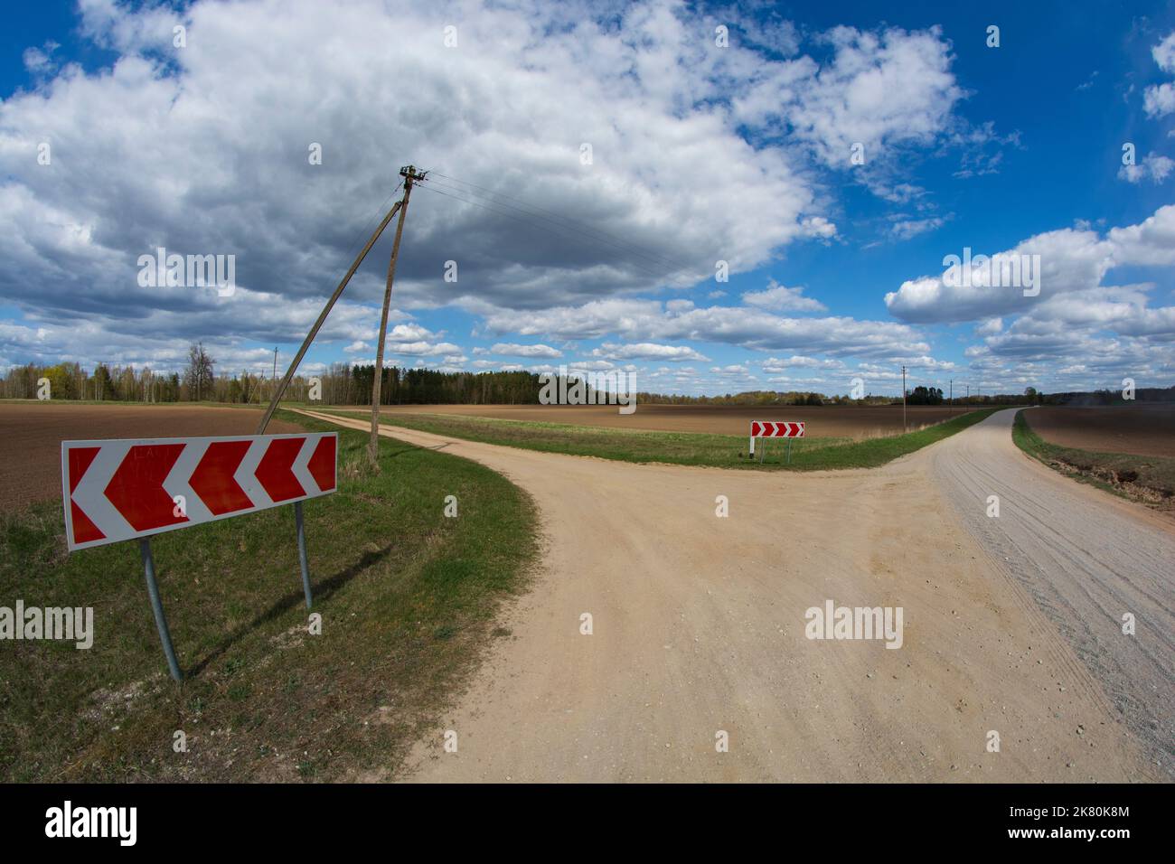 Summer time Crossroads two gravel roads and road sign Stock Photo - Alamy