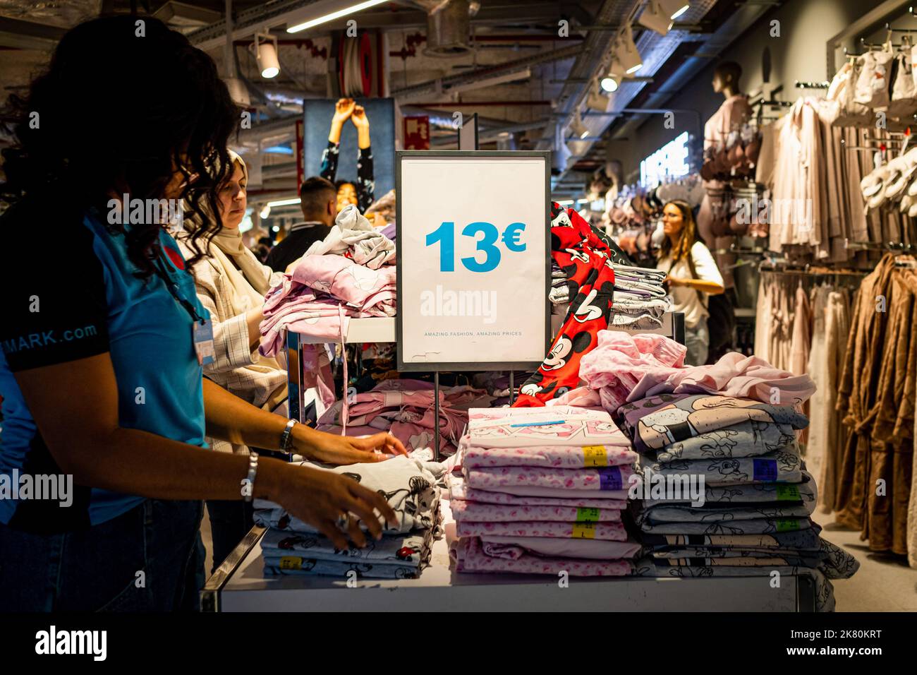 A store clerk seen inside a Primark clothing store. (Photo by Davide ...
