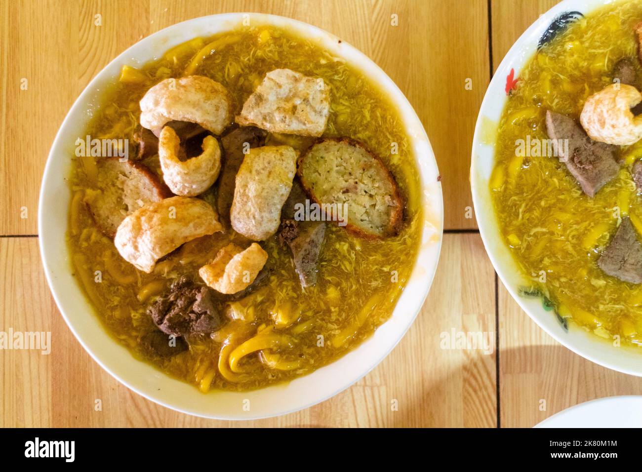 Bowls of a traditional noodle soup dish called lomi in Batangas ...