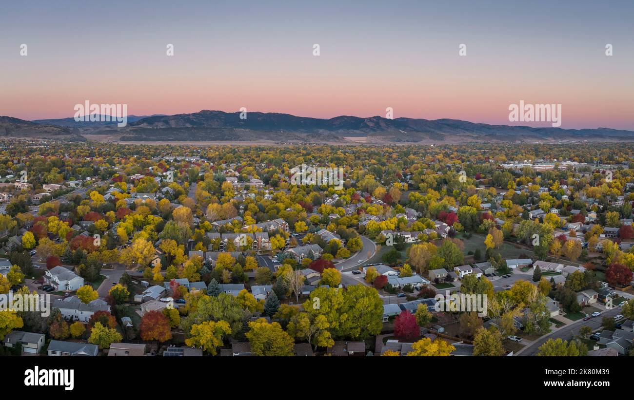 October dawn over Fort Collins and foothills of Rocky Mountains in ...