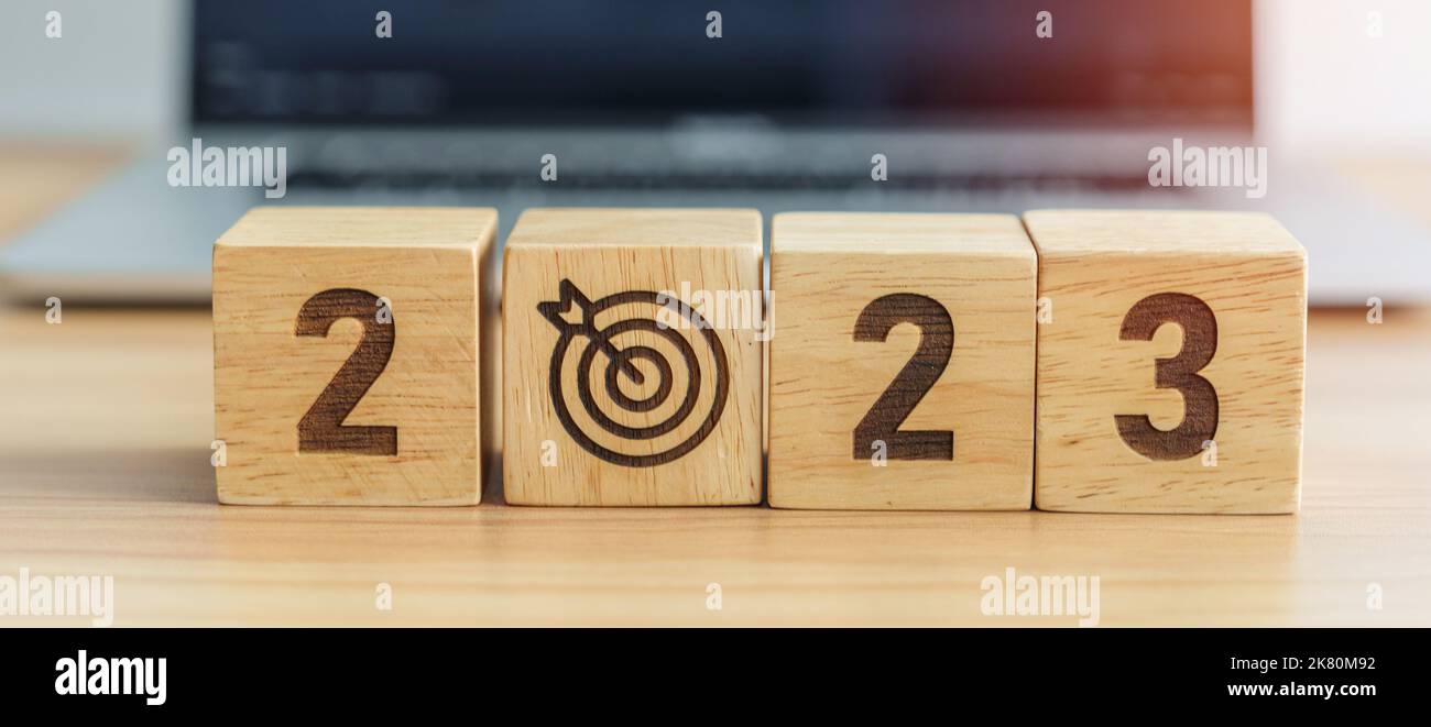 2023 Year block with dartboard icon against computer laptop background ...