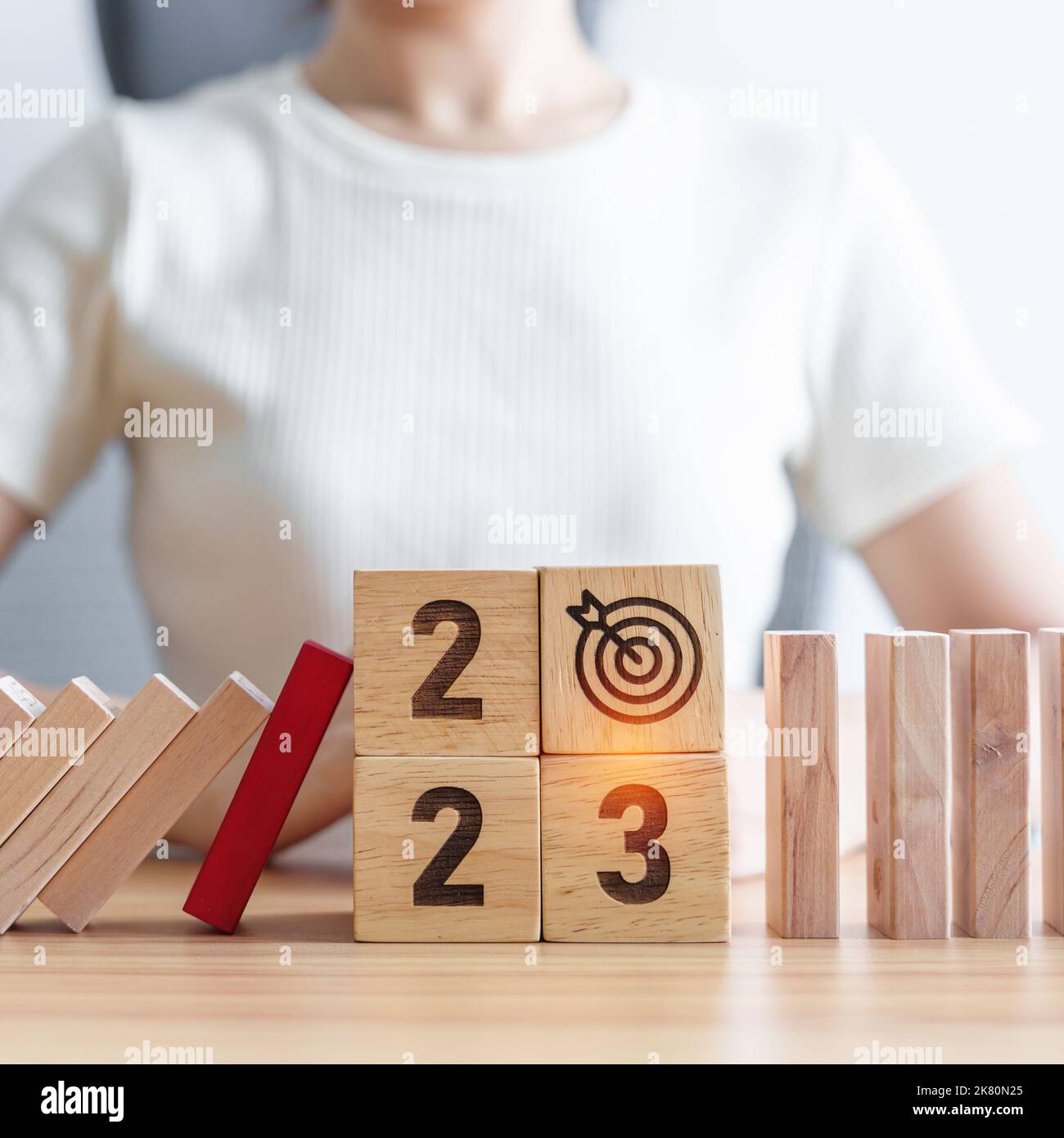 2023 year with falling blocks on table, Risk Management, recession ...