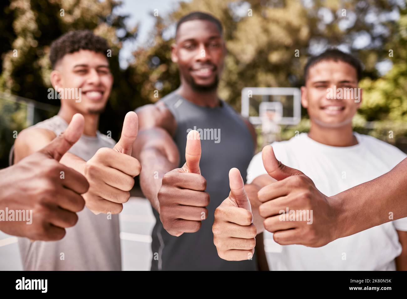 Basketball player, thumbs up and sports teamwork support, winner ...