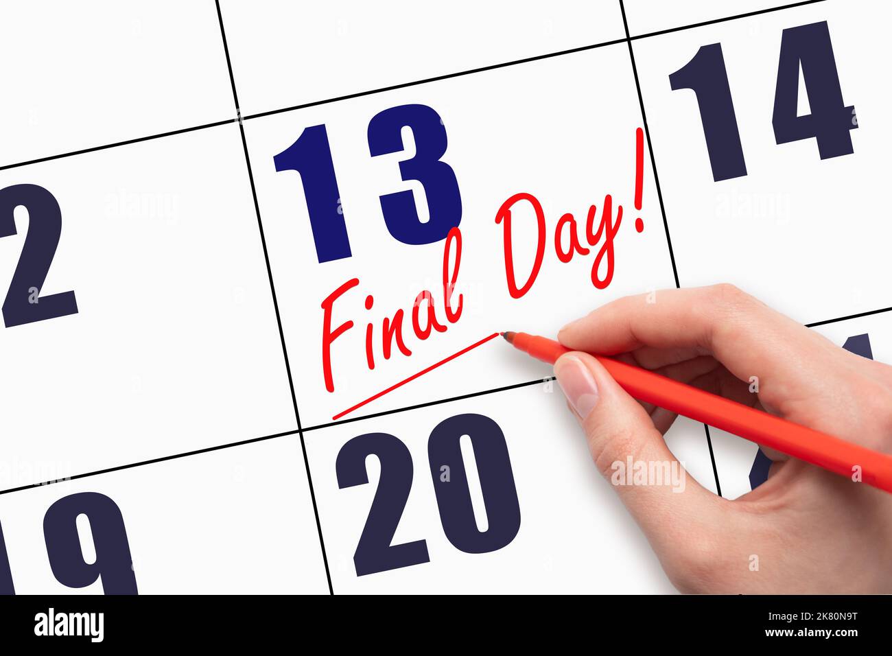 13th day of the month. Hand writing text FINAL DAY and drawing a line ...