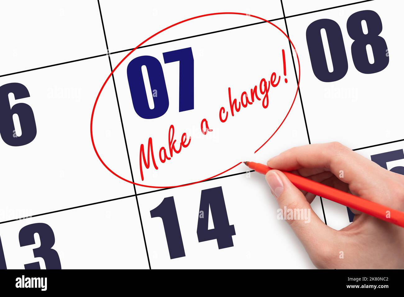 7th day of the month. Hand writing text MAKE A CHANGE and circling the ...