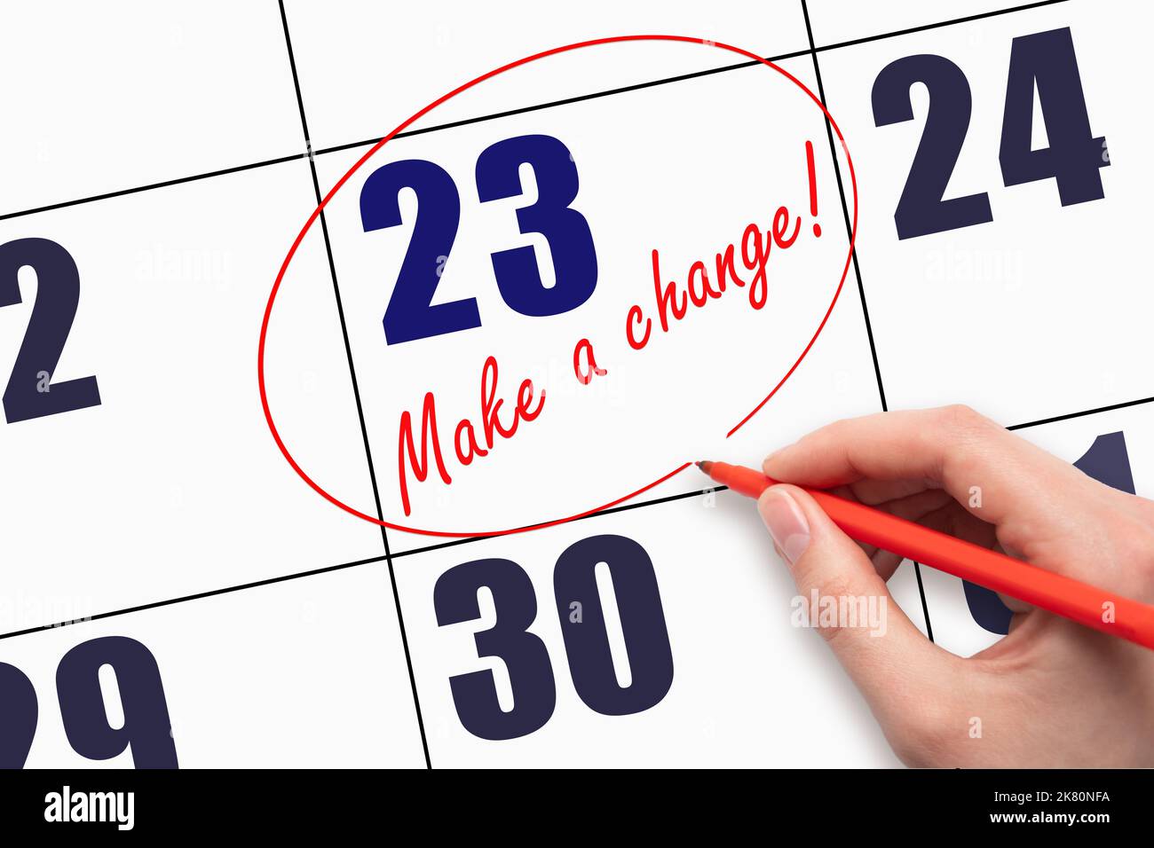 23rd day of the month. Hand writing text MAKE A CHANGE and circling the ...