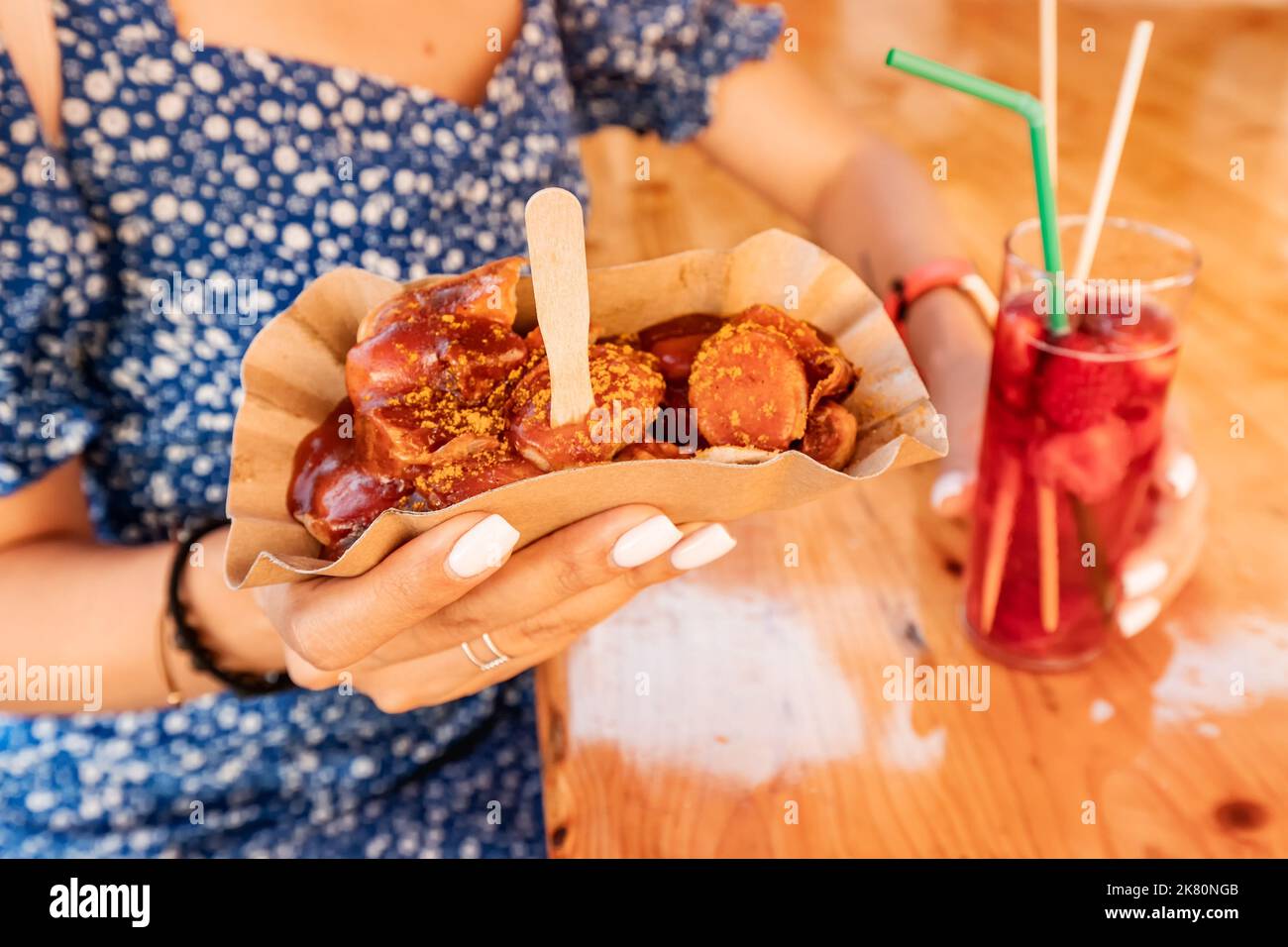 Streetfood german cuisine delicacy - currywurst and strawberry beer and ...