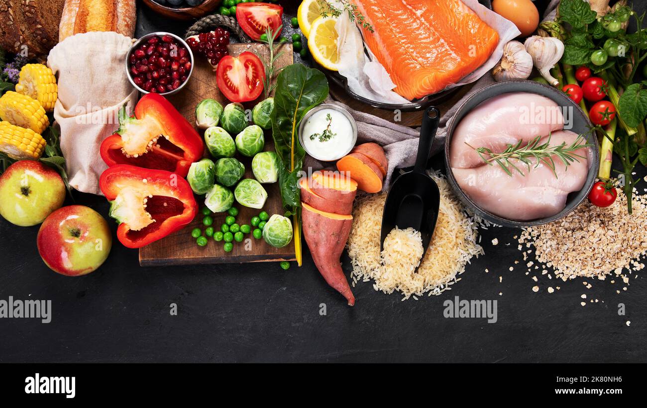 Healthy food selection on dark background. Detox and clean diet concept ...