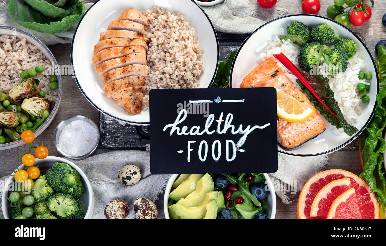 Table of various healthy food dishes. Healthy food assortment. Dieting ...