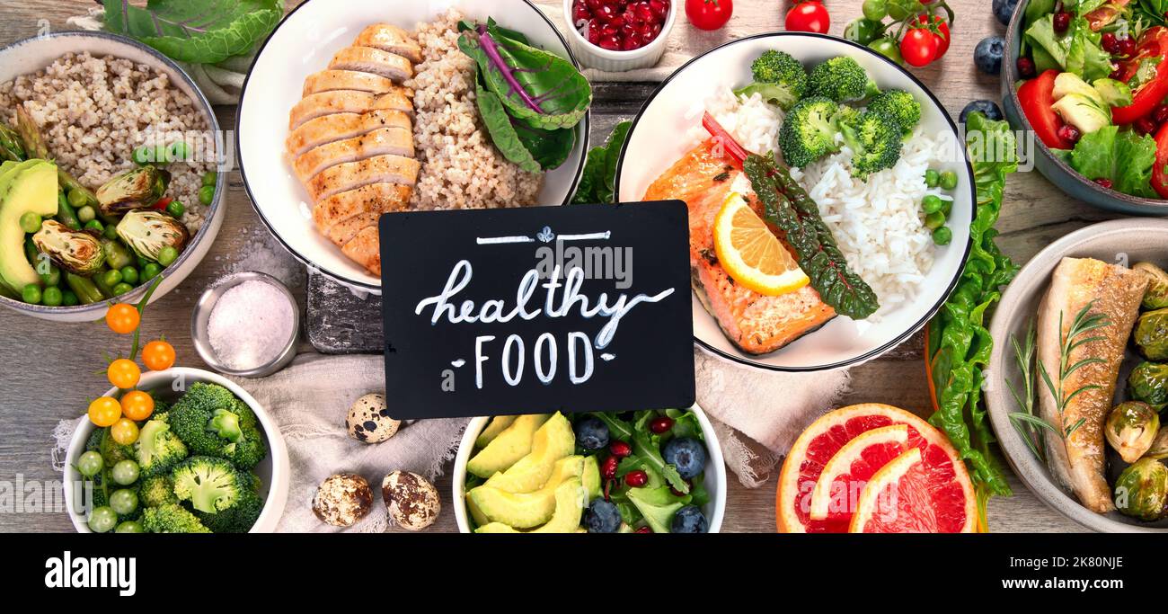 Table of various healthy food dishes. Healthy food assortment. Dieting ...