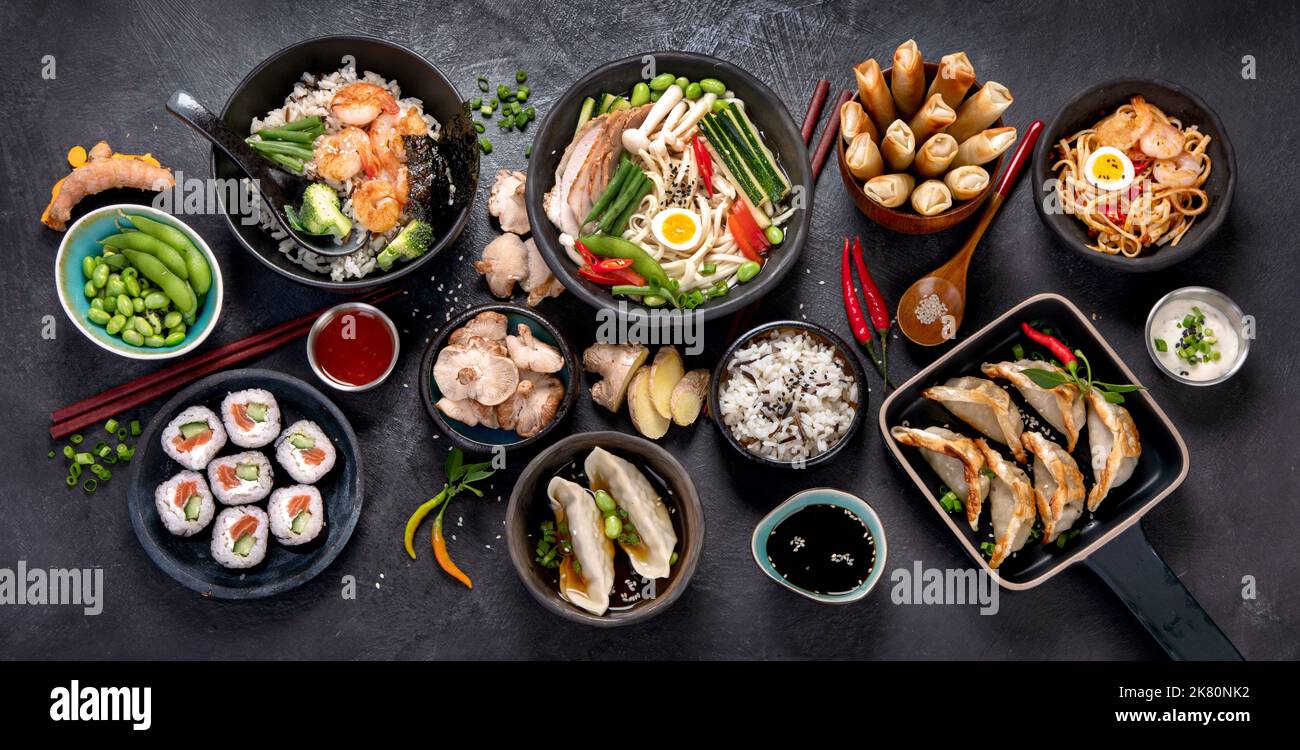Traditional Asian food. Various of asian meals on dark background ...