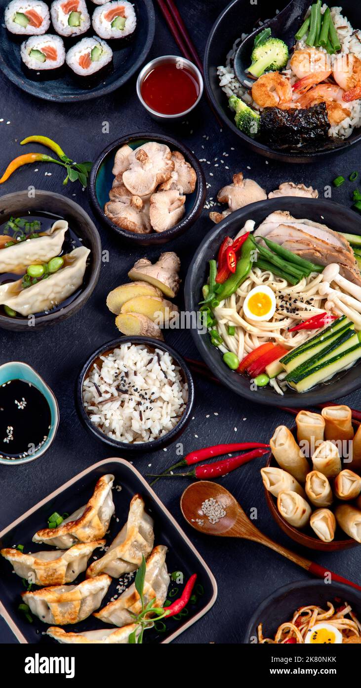 Traditional Asian food. Various of asian meals on dark background ...