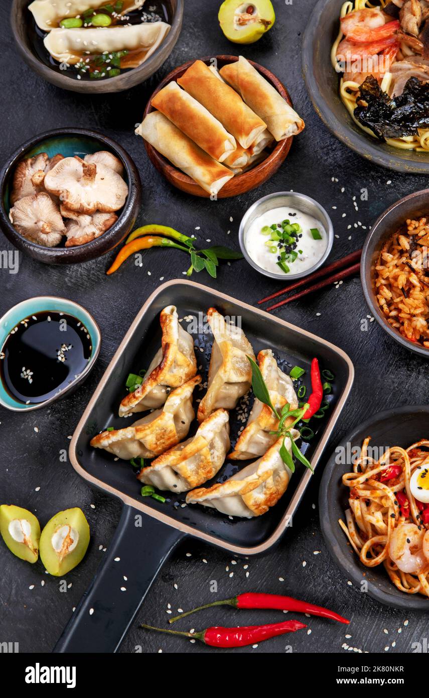Traditional Asian food. Various of asian meals on dark background ...