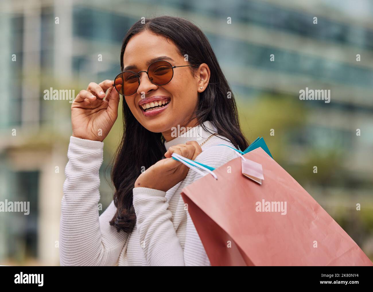 Shopping bag, retail and portrait of woman with sunglasses walking in ...