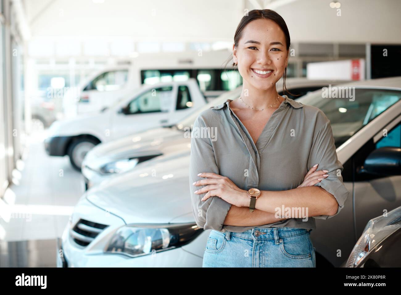 Im ready to experience that new car smell. a young woman standing next ...