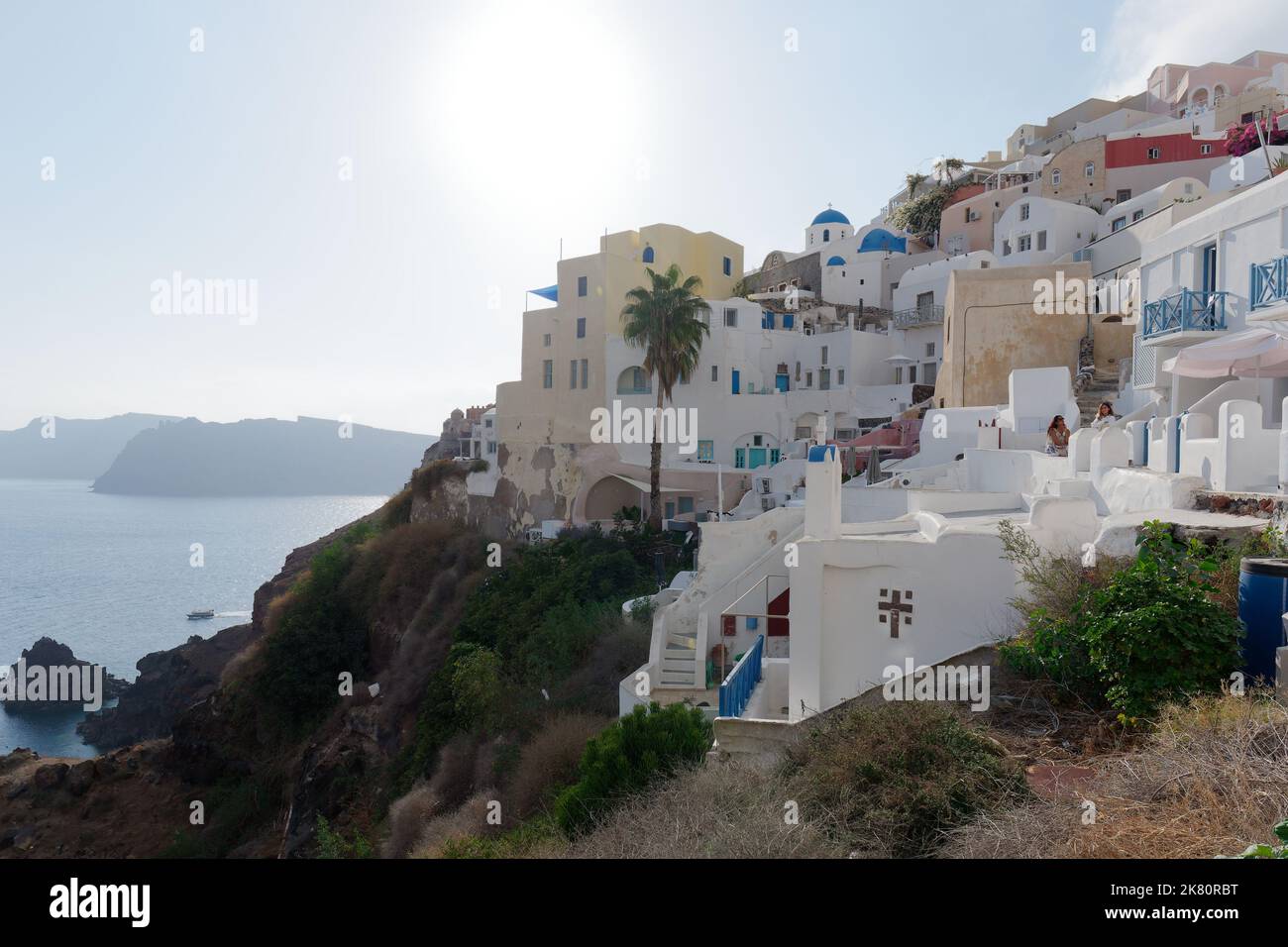 Town of Oia with its famous blue domed buildings and Caldera view ...