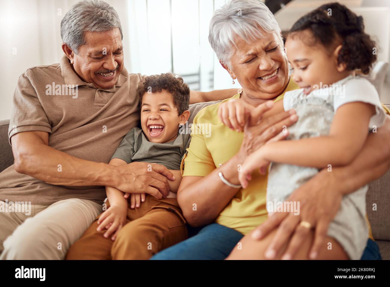 Love, happy family and grandparents with funny kids at home for ...