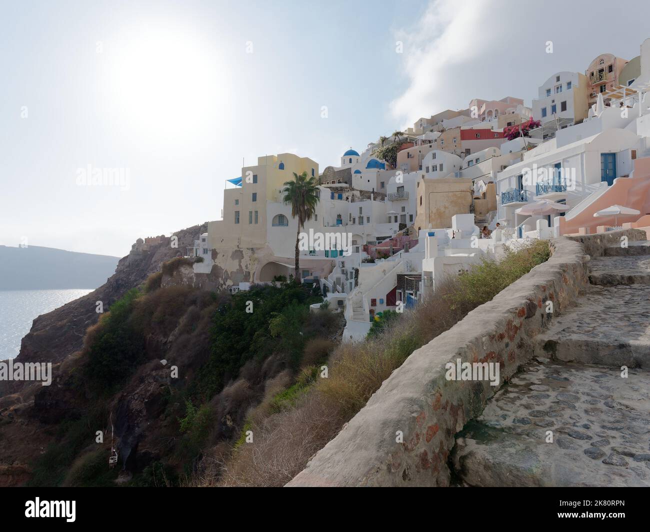 Town of Oia with its famous blue domed buildings and Caldera view ...