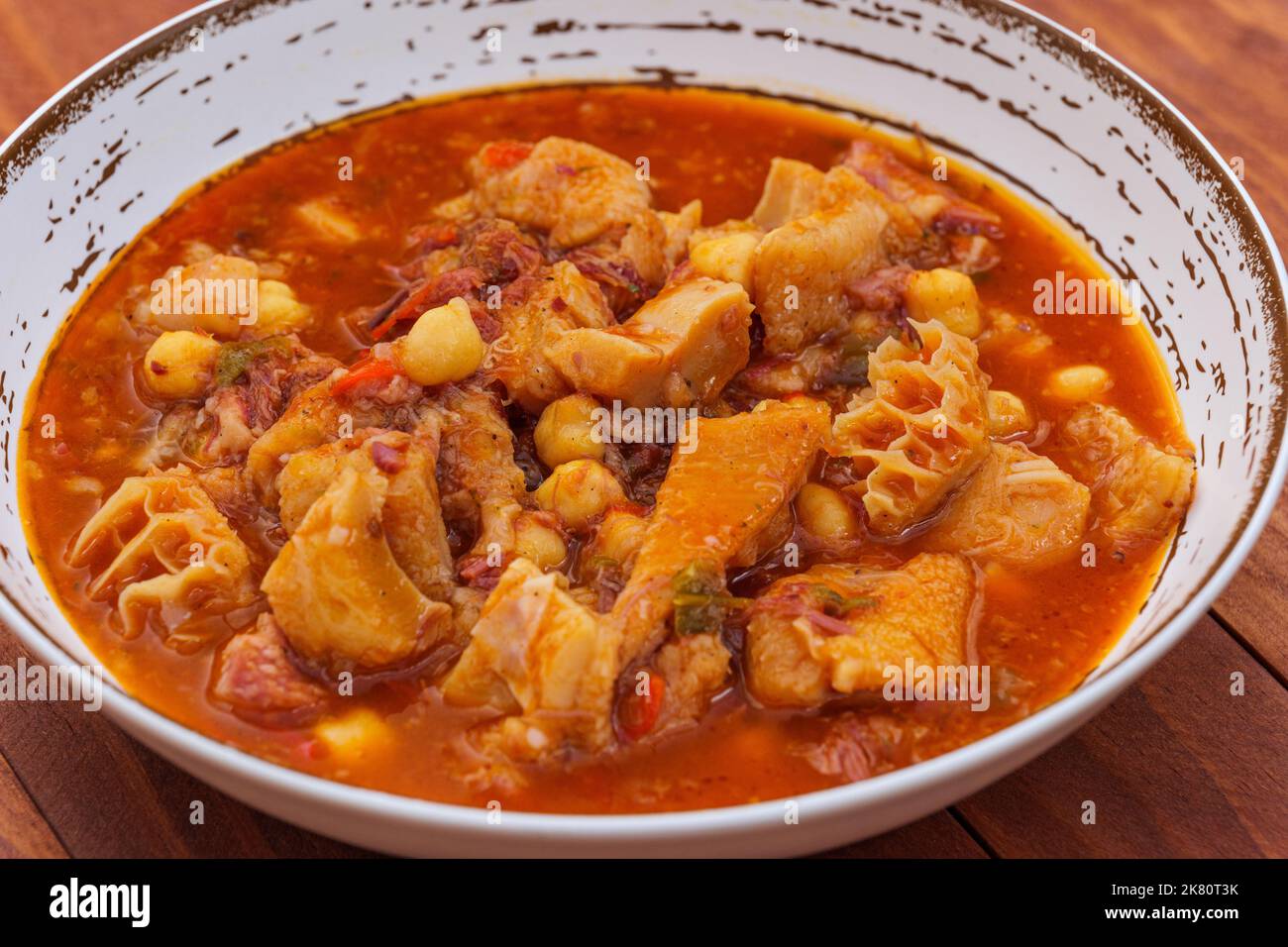 Madrid style tripe on rustic plate on a wooden table. Callos a la ...