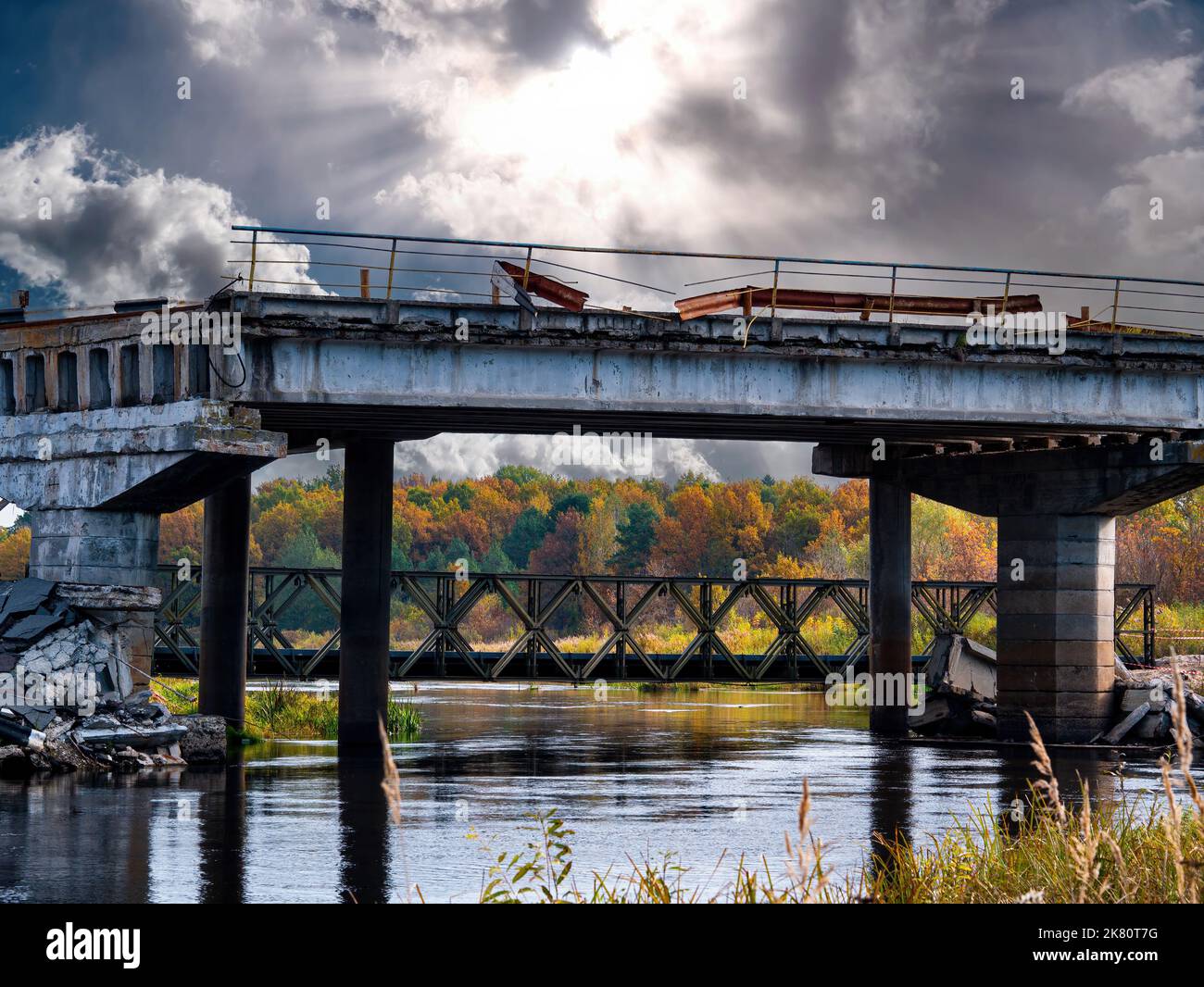 Destroyed automobile reinforced concrete bridge across the river ...