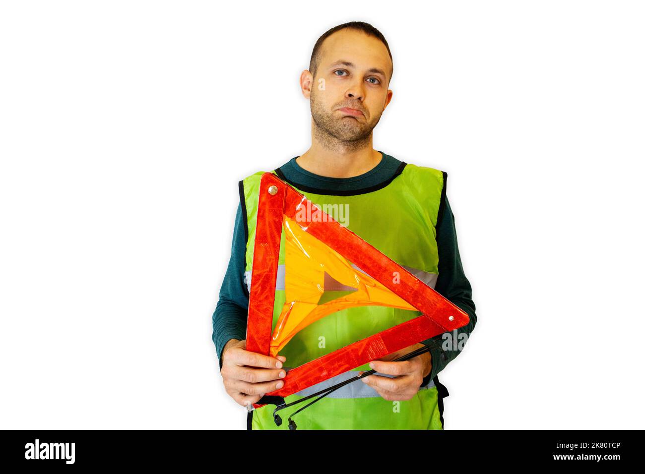 a man in an emergency vest and an emergency sign in his hands. problems ...