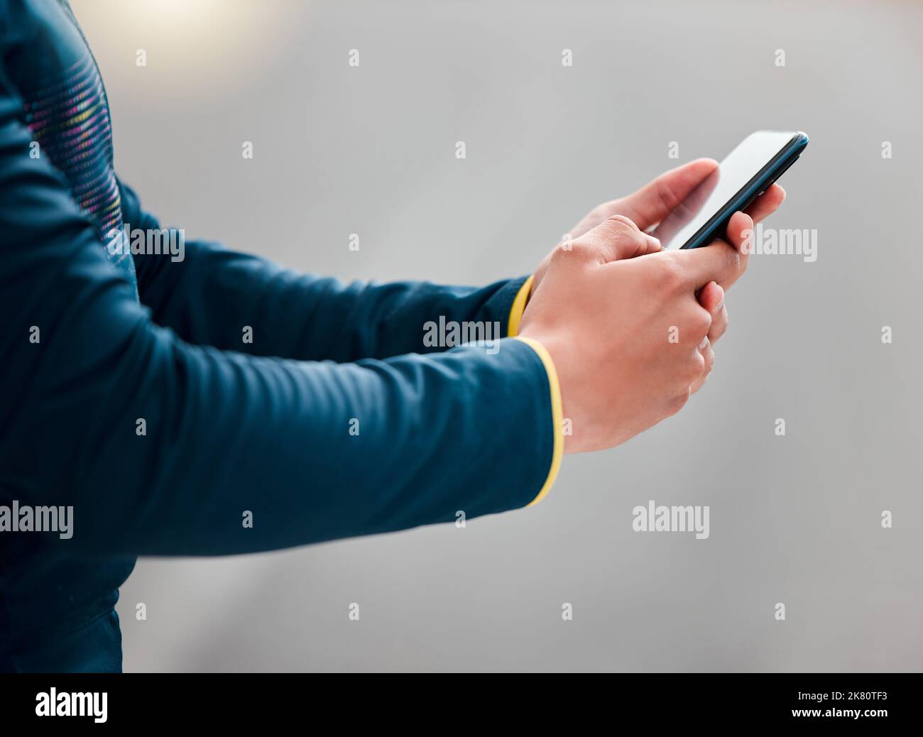 Workout, hands and man typing on smartphone outside, checking GPS with ...