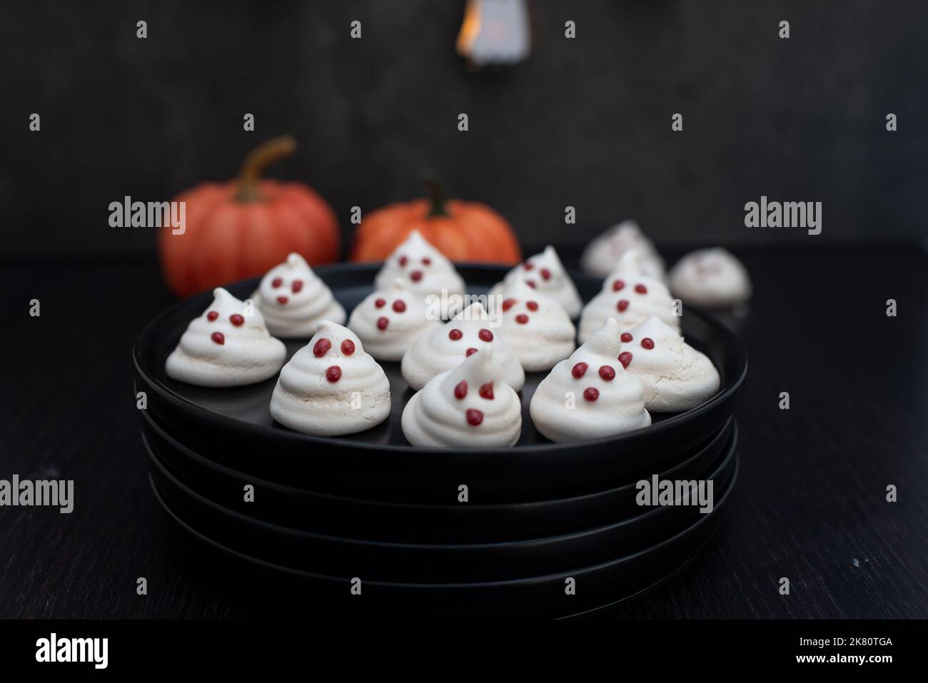 Funny meringue ghosts with funny faces, Halloween dessert Stock Photo ...