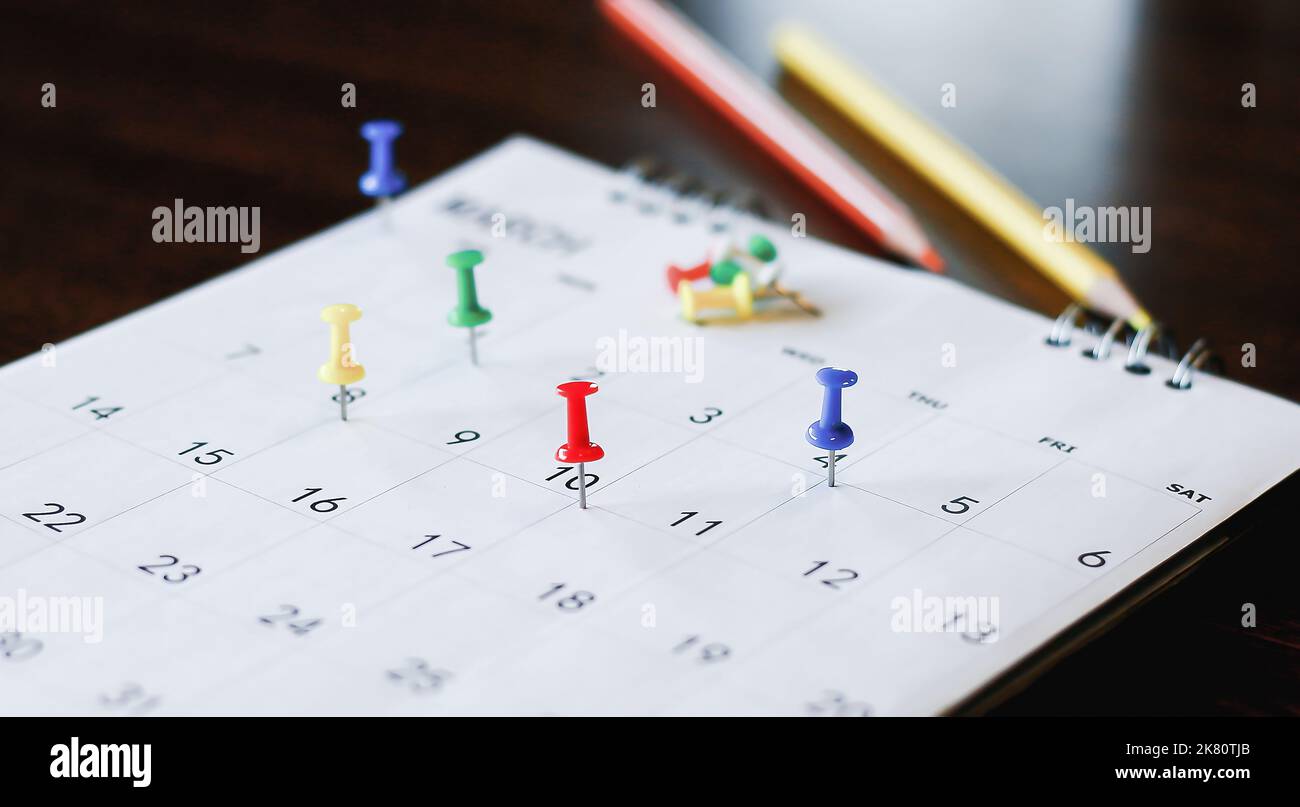 White desk calendar on dark wooden table, planning concept Stock Photo ...