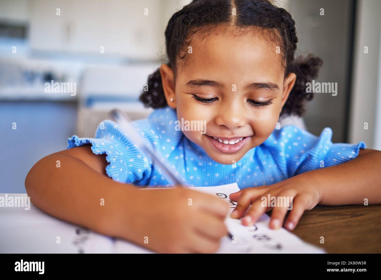 Homework, drawing and child writing in a notebook for education ...