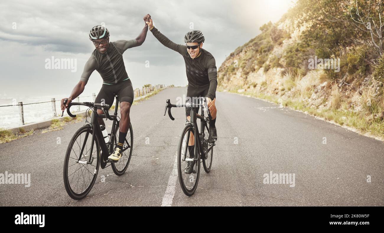 Fitness, high five and friends cycling on the road for cardio exercise ...