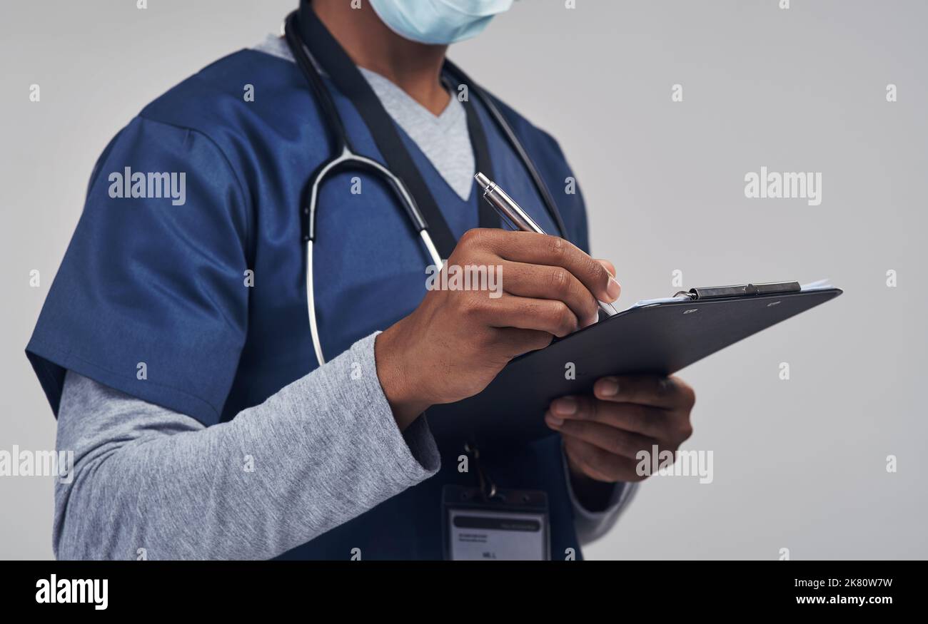 I came. I cared. I charted. a medical practitioner making notes on his ...