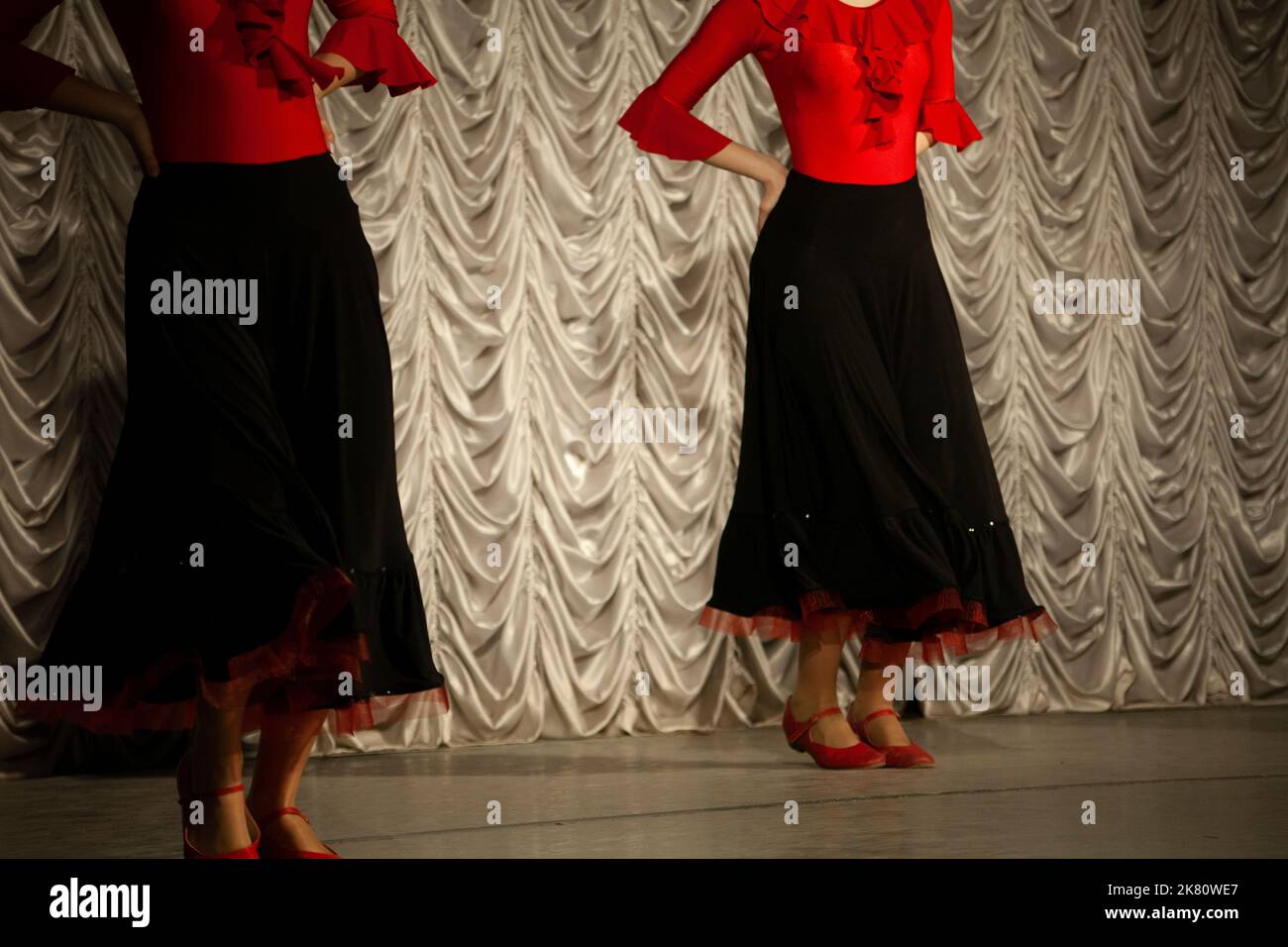 Spanish dance. Girls dancing in black dresses. Dance lesson. Spanish ...