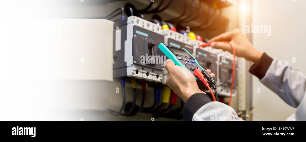 Electrician engineer work tester measuring voltage and current of power ...