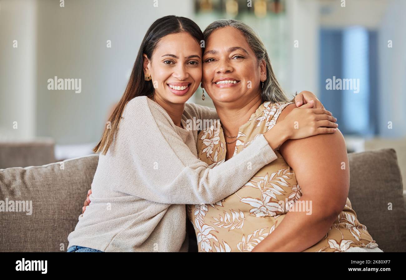 Woman, happy and hug of a mother and adult child on a home living room ...