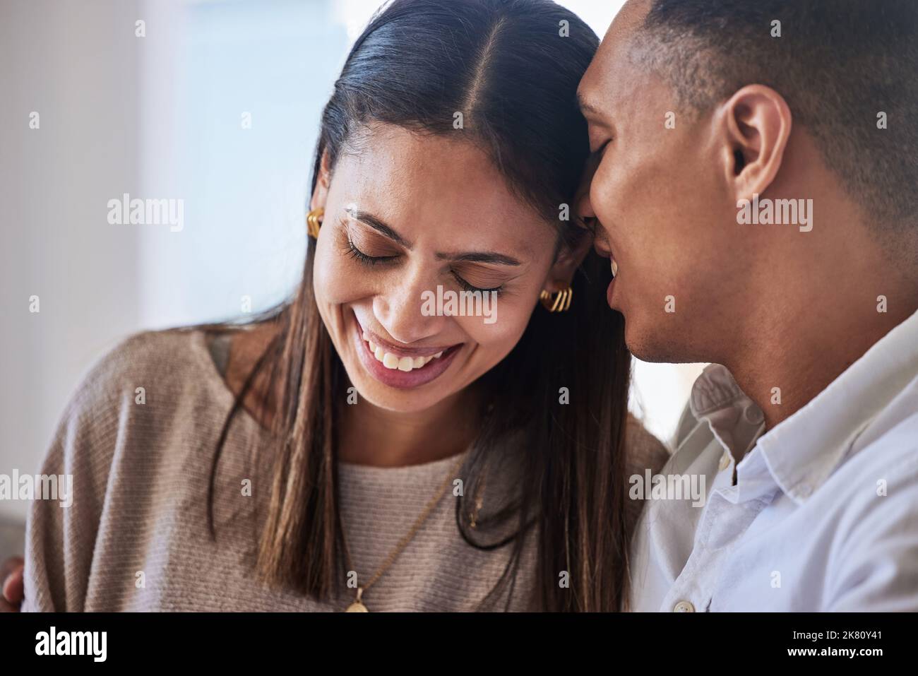 Love, happy and couple whisper in ear for relationship, secret and ...