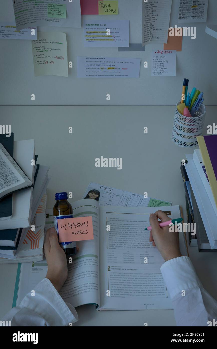 studying at home, study desk setup stacked workbooks and invigorating ...