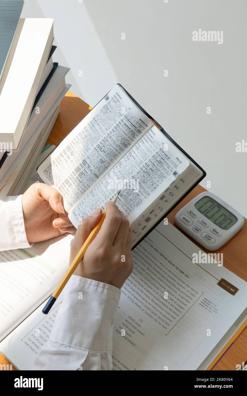 Looking at the dictionary hi-res stock photography and images - Alamy