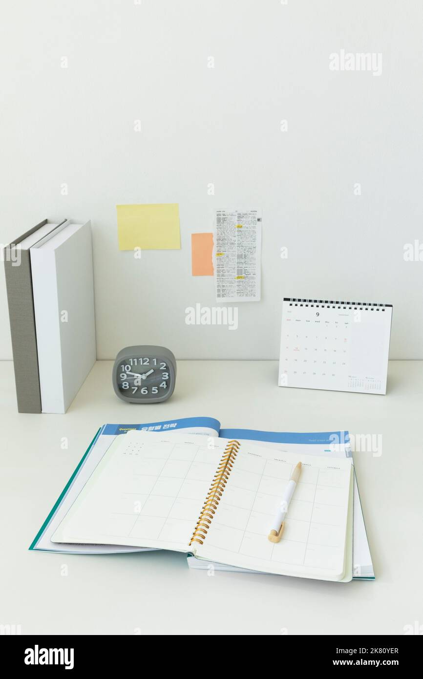 studying at home, study desk setup studying dictionaries and workbooks ...