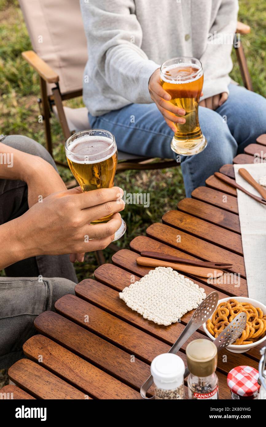 camping mood aesthetics drinking beer Stock Photo - Alamy