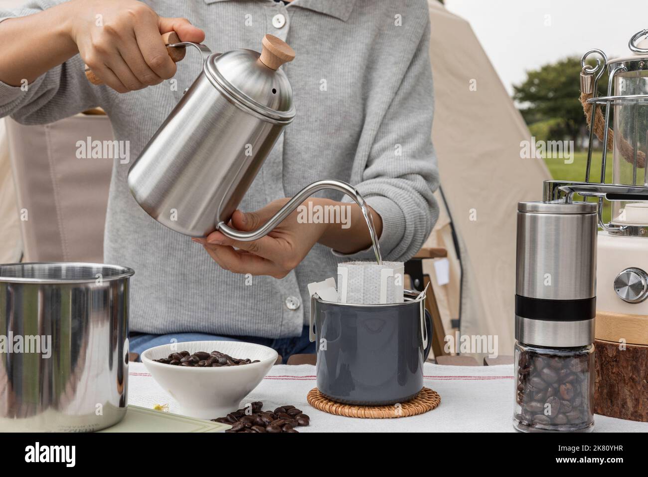 camping mood aesthetics making drip coffee Stock Photo - Alamy