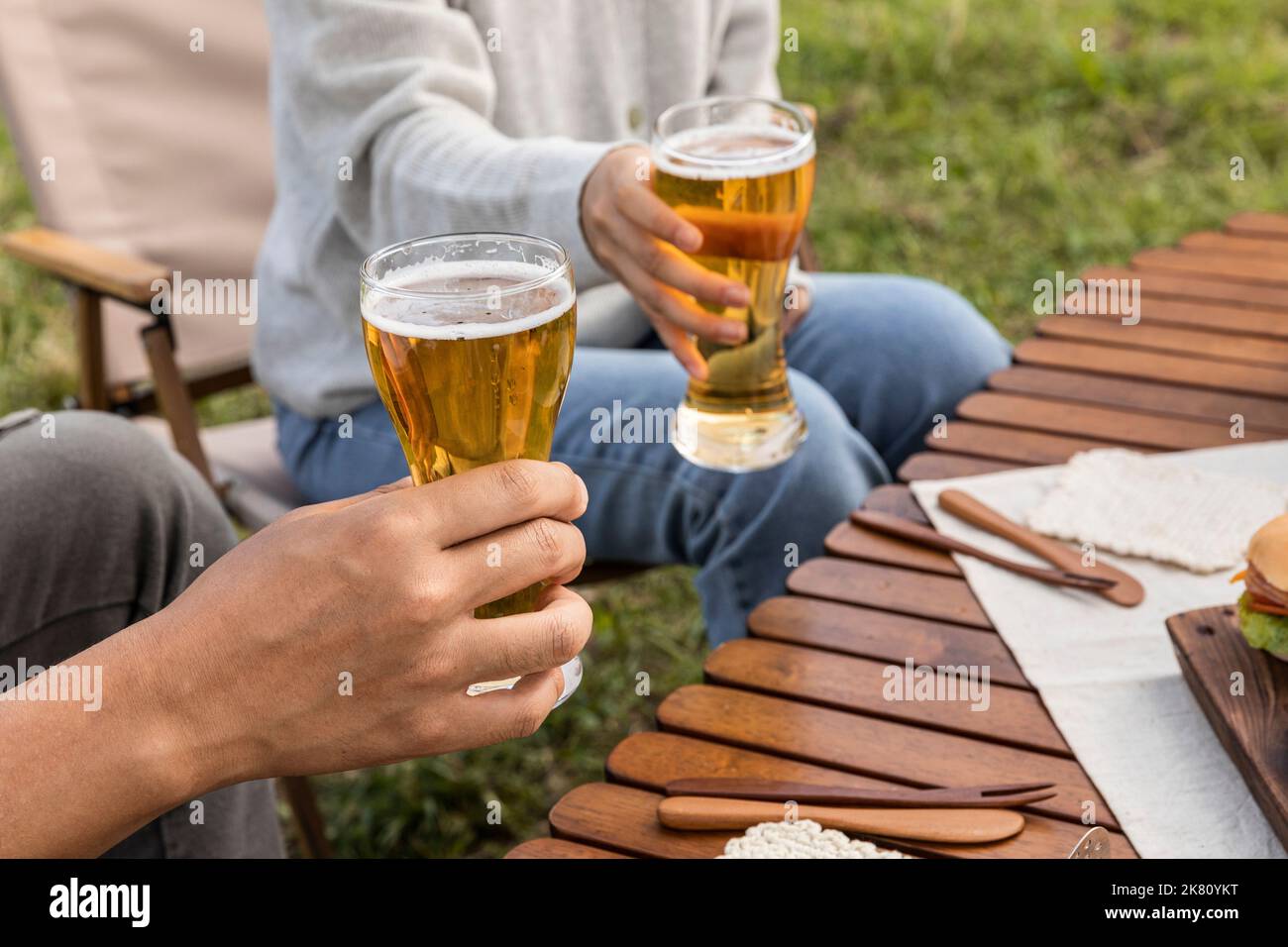 camping mood aesthetics drinking beer Stock Photo - Alamy
