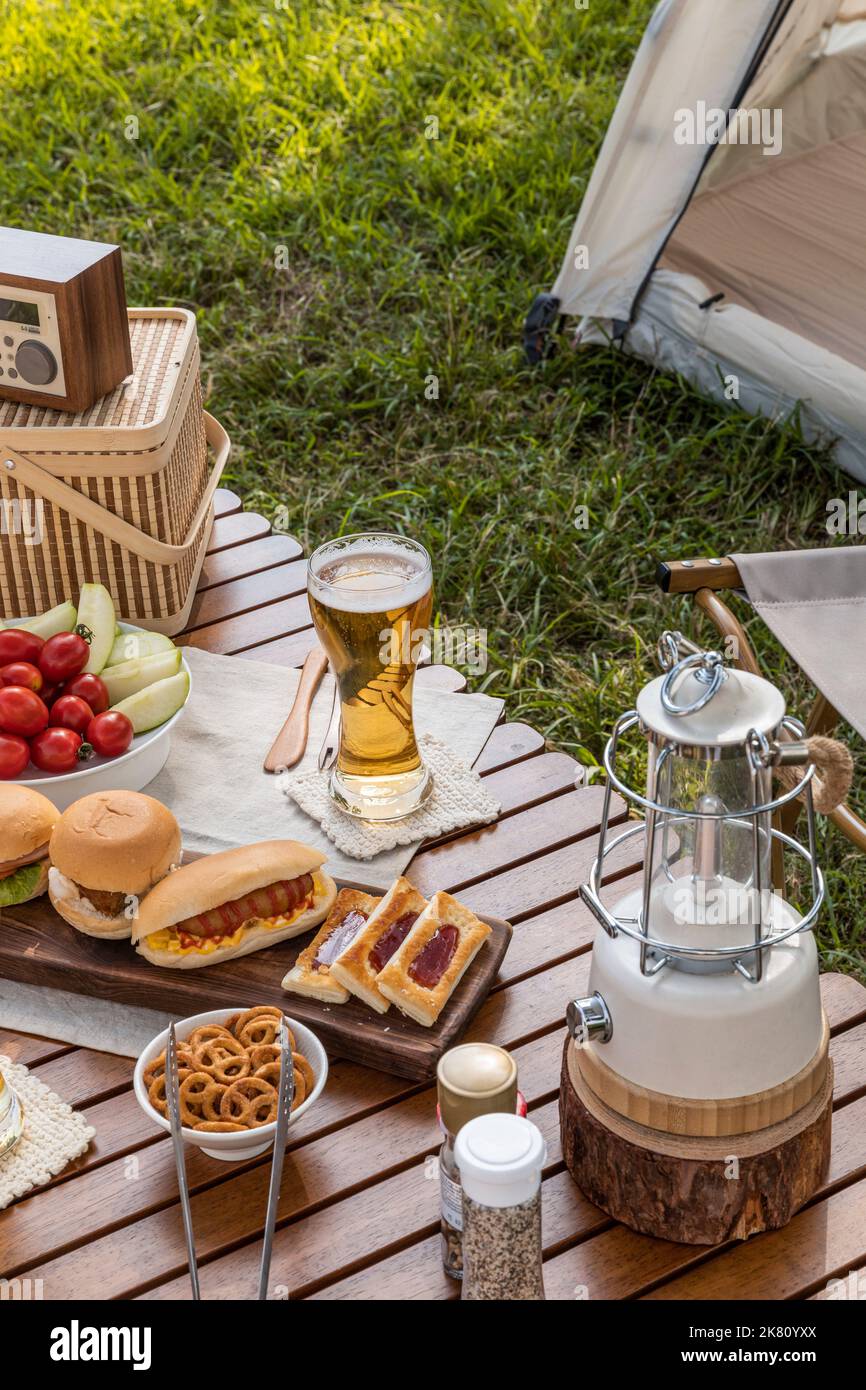 camping mood aesthetics beer and side dishes served on the tablet Stock ...
