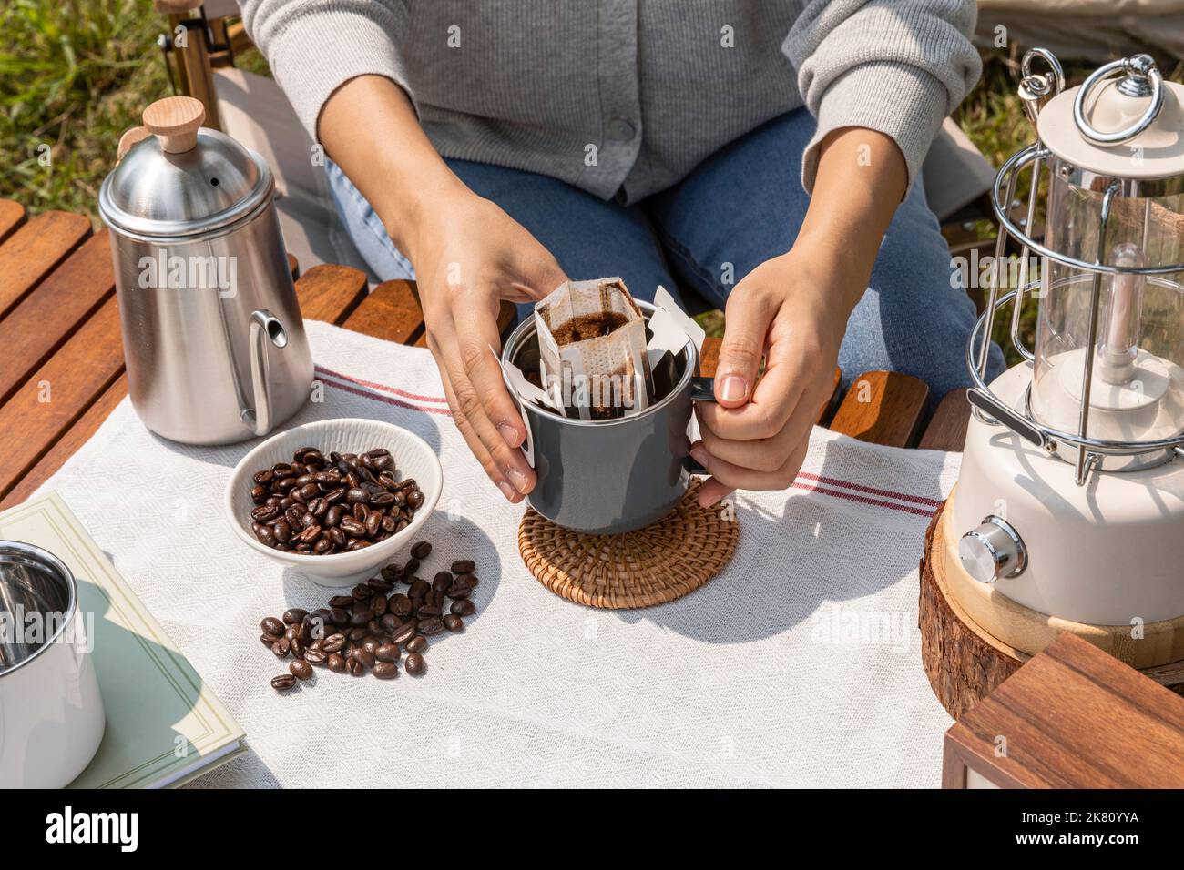 camping mood aesthetics making drip coffee Stock Photo - Alamy
